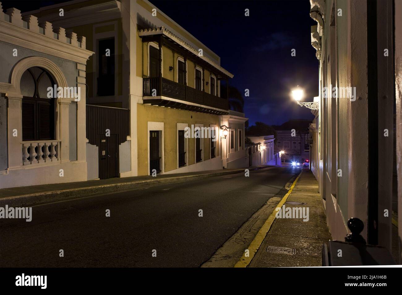 Glowing street lights illuminate the sleepy streets of Old San Juan ...