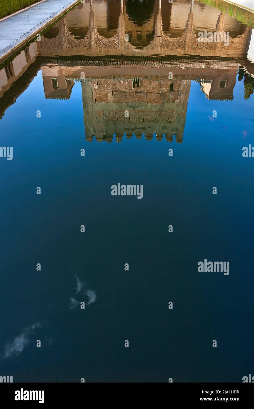 Comares Tower reflected in water of Patio de los Arrayanes 14th century ...