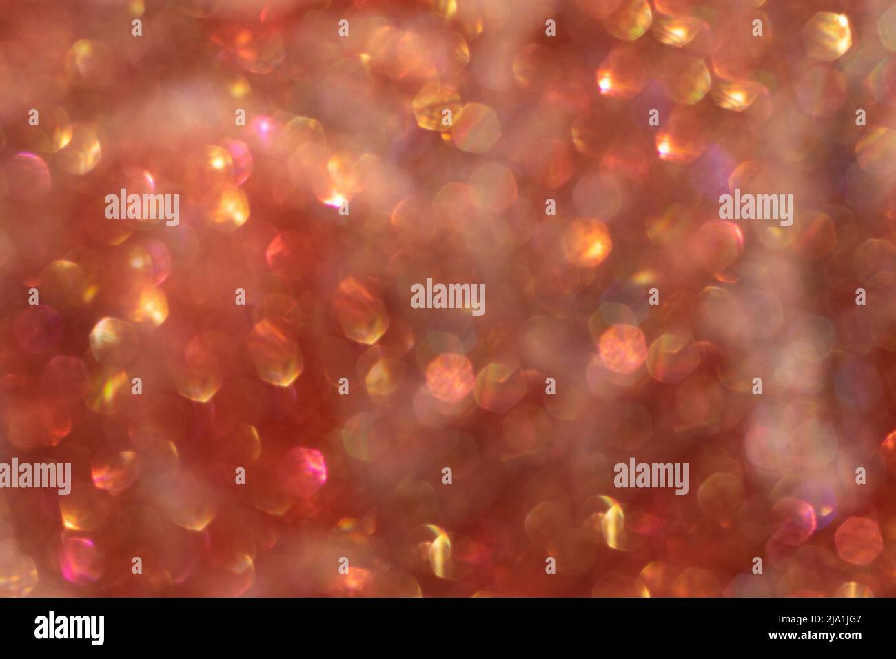 Abstract defocused bronze background with shining glitter.Good as ...