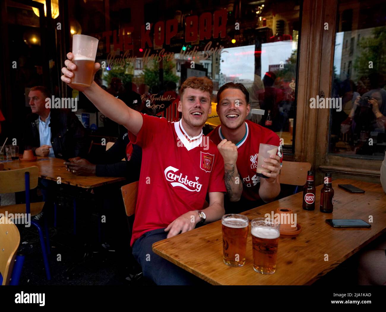 Liverpool fans pose for a photo at The Kop Bar in Paris ahead of ...