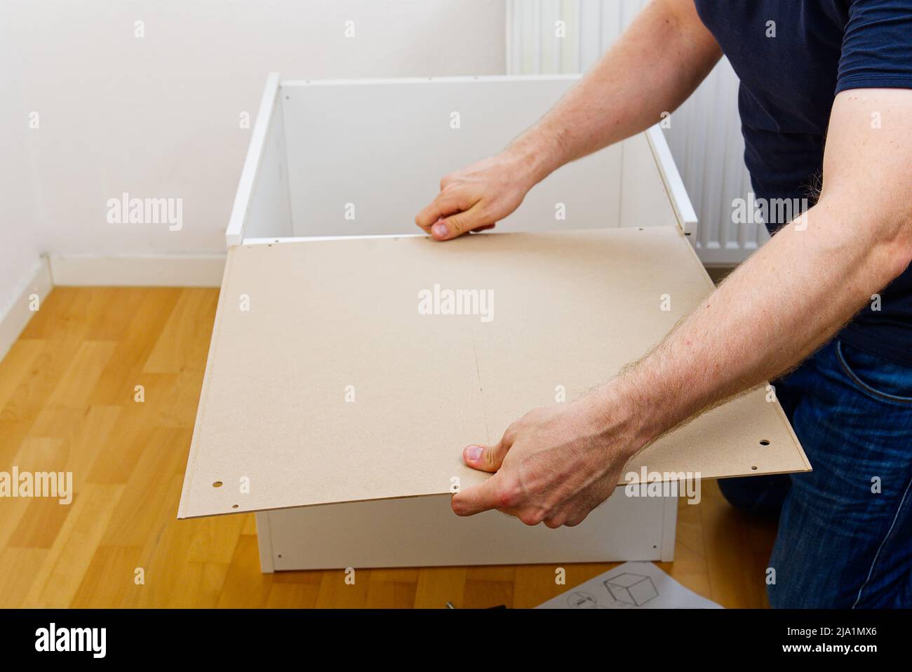Professional Furniture Assembly Worker Assembles Shelf. Furniture ...