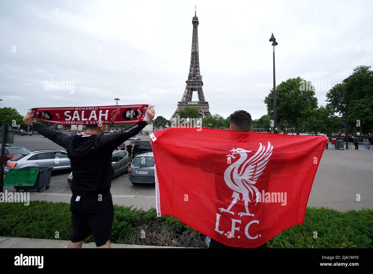 Liverpool fans pose for a photo in front of the Eiffel Tower in Paris ...