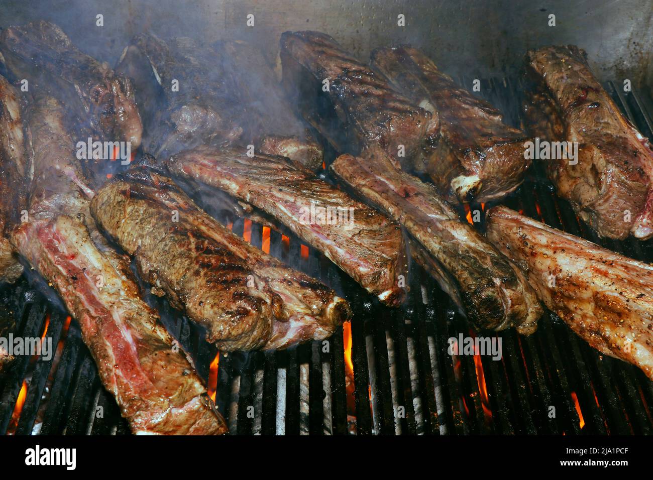 american angus cattle beef spare ribs marinade on a barbeque grill on ...