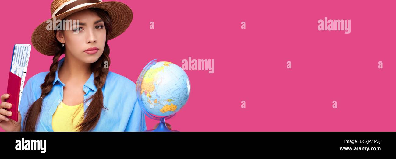Female student traveler holding plane tickets, passport and globe ...
