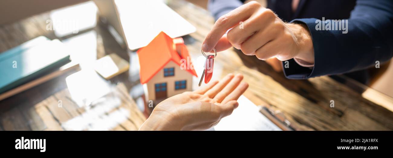 Realtor Giving House Keys To Client After Signing Contract Stock Photo ...