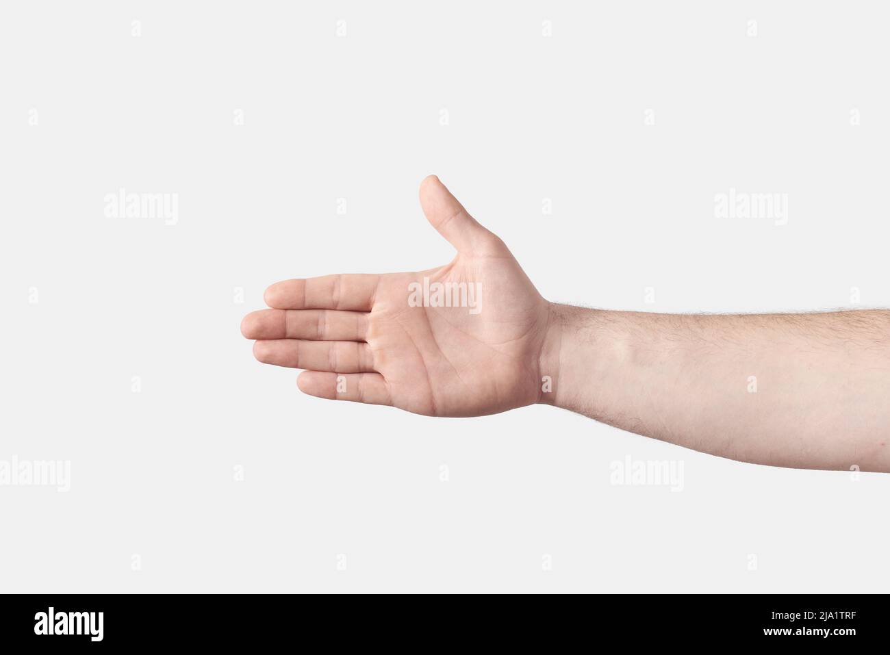 Close up handshake reaching male hand on white Stock Photo - Alamy