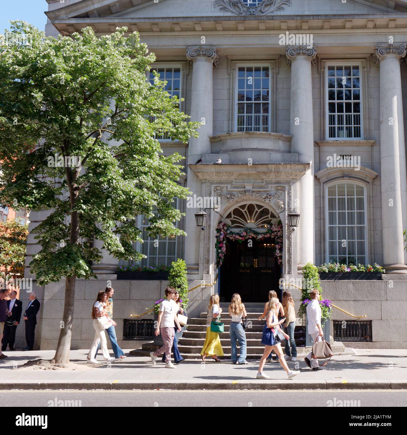 London, Greater London, England, May 14 2022: People walking past ...