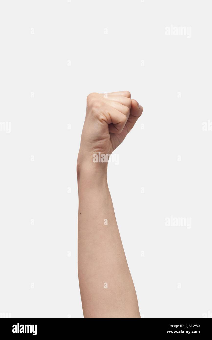 Close up female aggressive hand fist gesture on white Stock Photo - Alamy