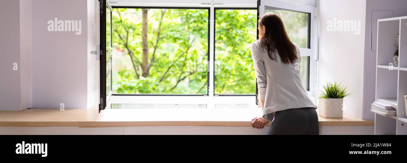 Woman open window home fresh air hi-res stock photography and images ...
