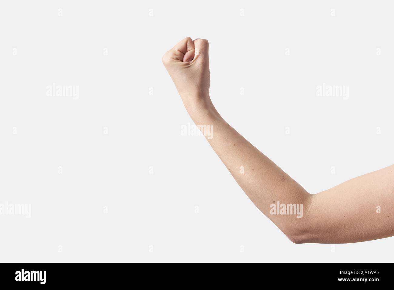 Female arm to shoulder gesturing power and strength on white Stock ...