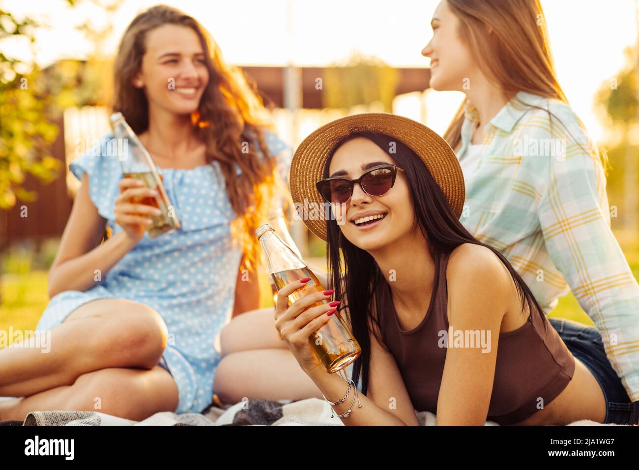 Group of smiling happy beautiful best friends sitting together on a ...