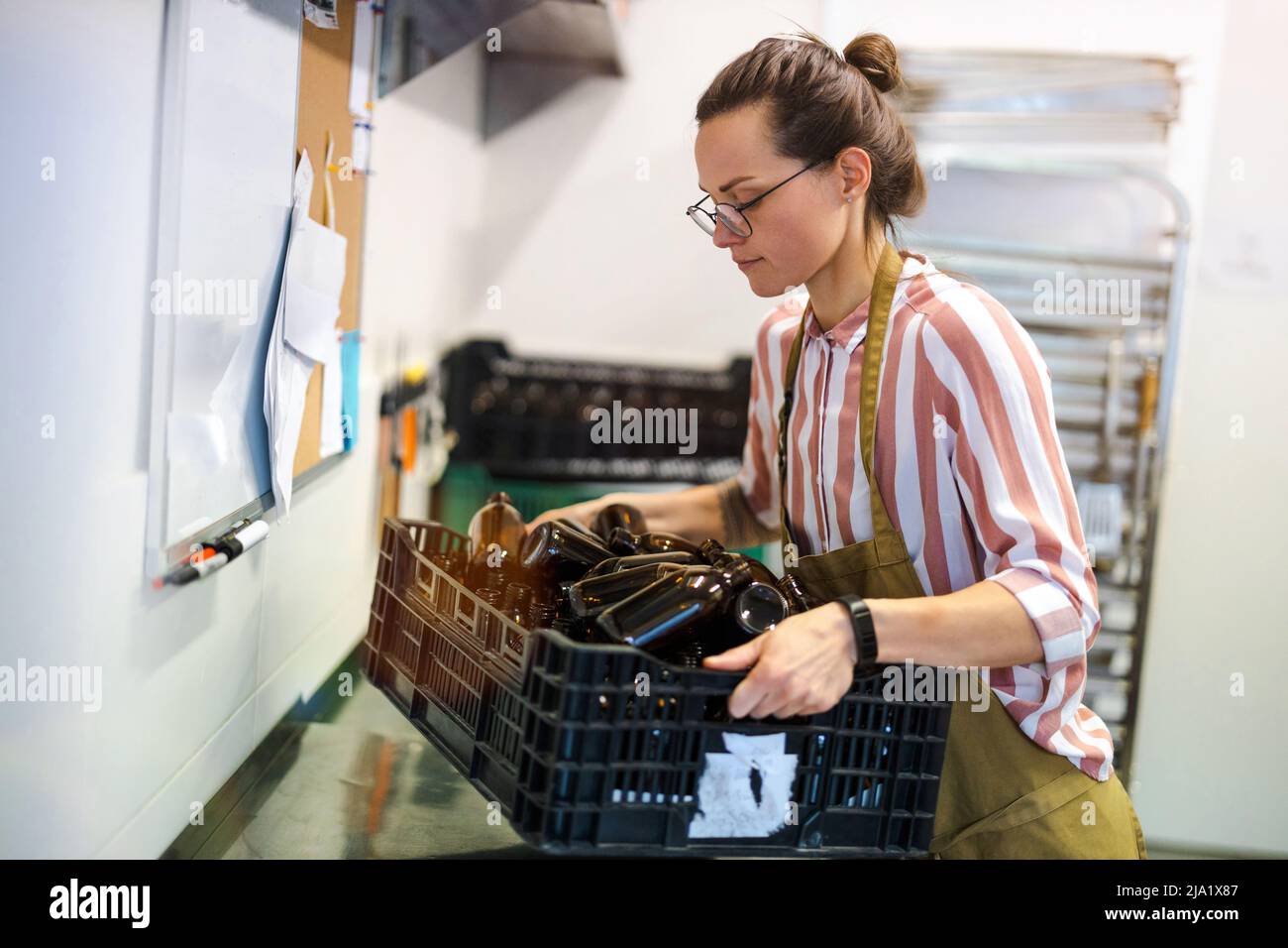 Woman working in a small food manufacturing company Stock Photo - Alamy