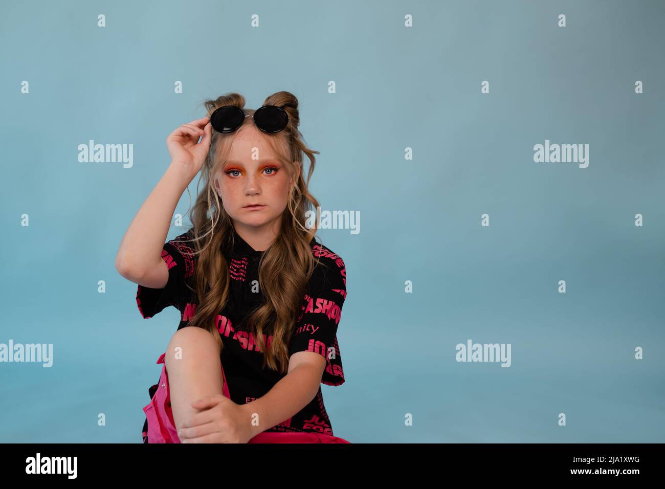 fashion teenager portrait. tween school girl with orange makeup wearing ...