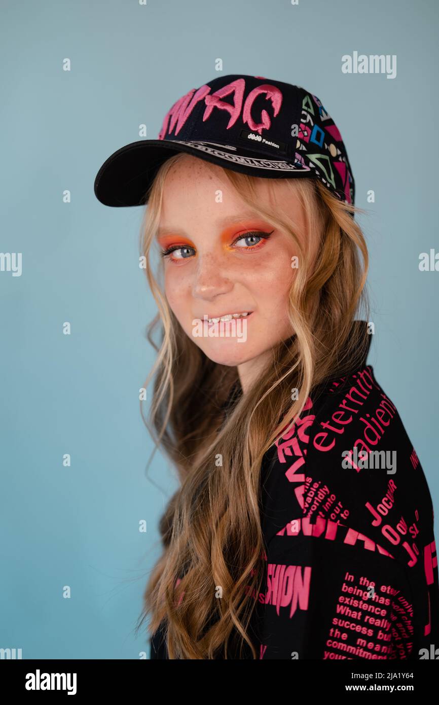 fashion teenager portrait. tween school girl with orange makeup wearing ...