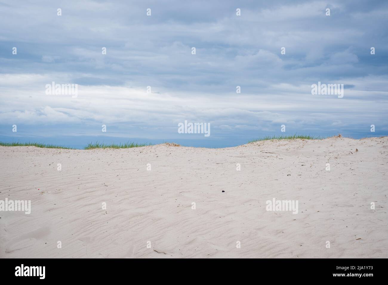 Empty sand dunes and blue sky. Beach background. Relaxing scenic ...