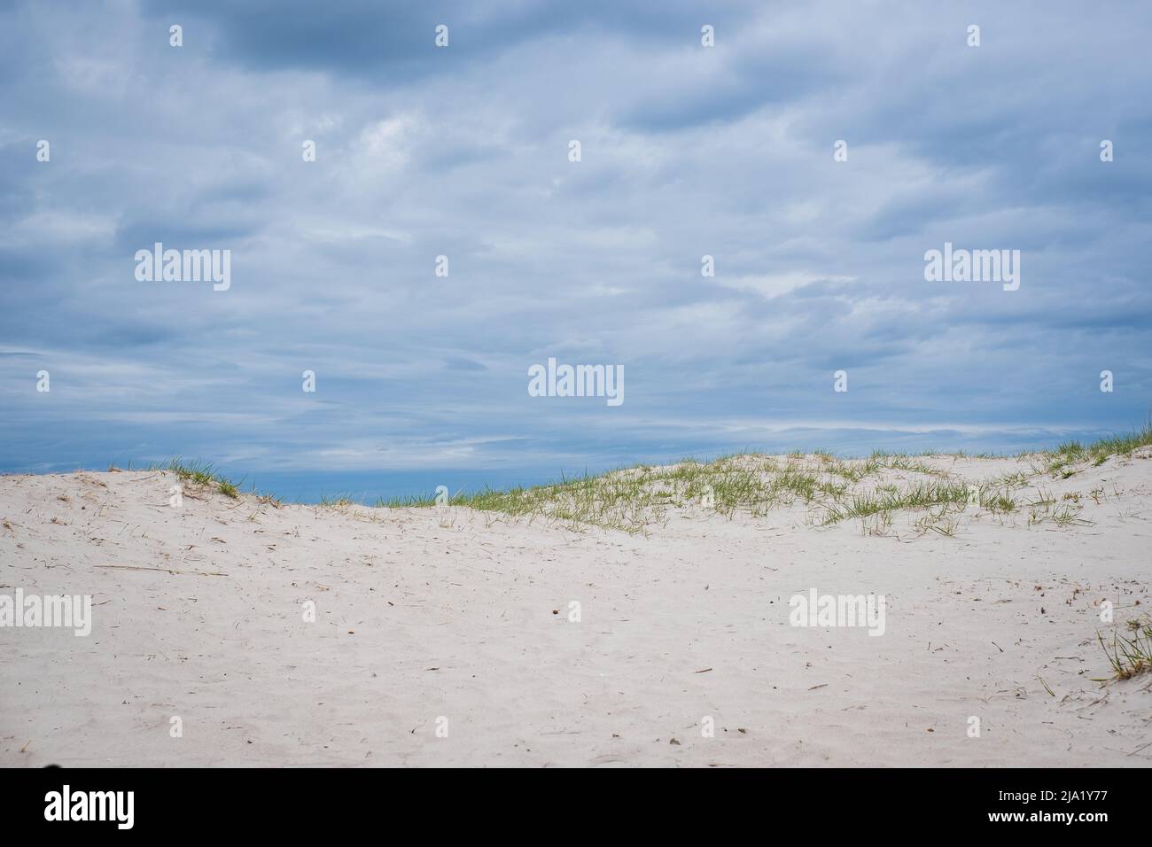 Empty sand dunes and blue sky. Beach background. Relaxing scenic ...