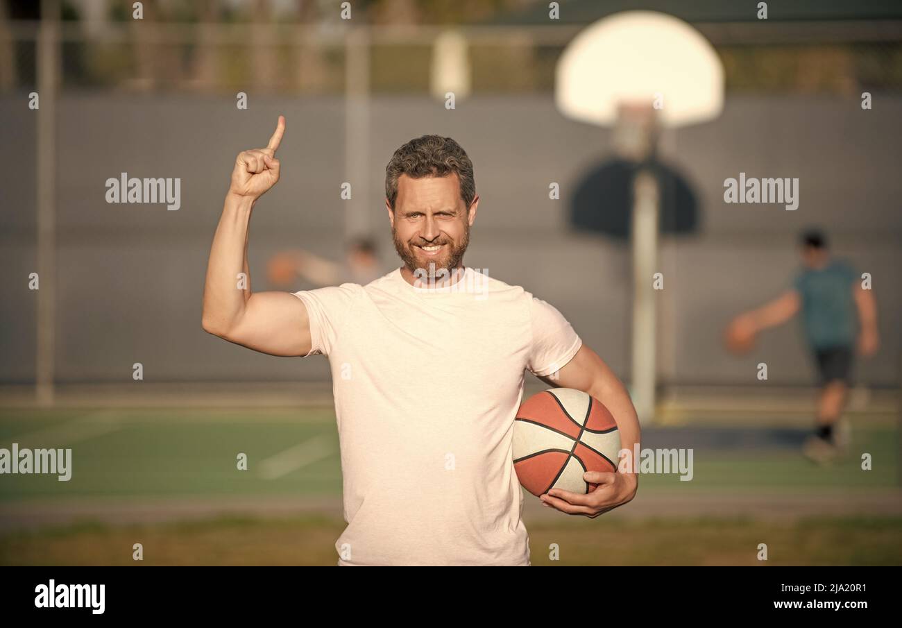 muscular man with basketball ball. sport trainer or basketball player ...