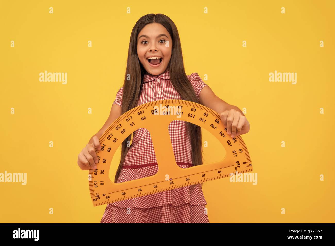 education for child. mathematics. amazed teen girl hold protractor ...