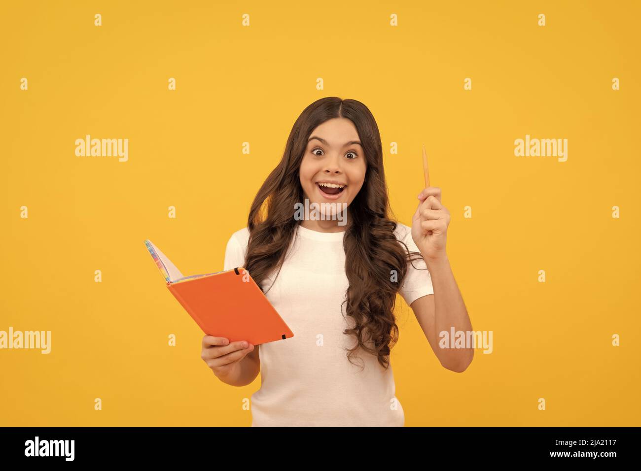 inspired school child ready to study making notes in workbook, school ...