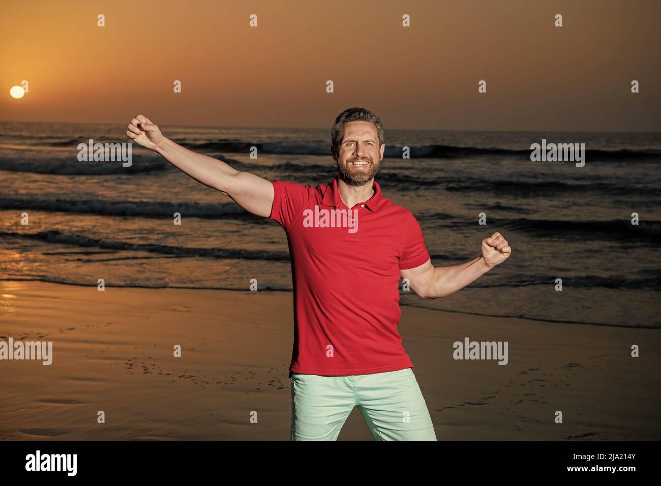 Happy man celebrating success hi-res stock photography and images - Alamy