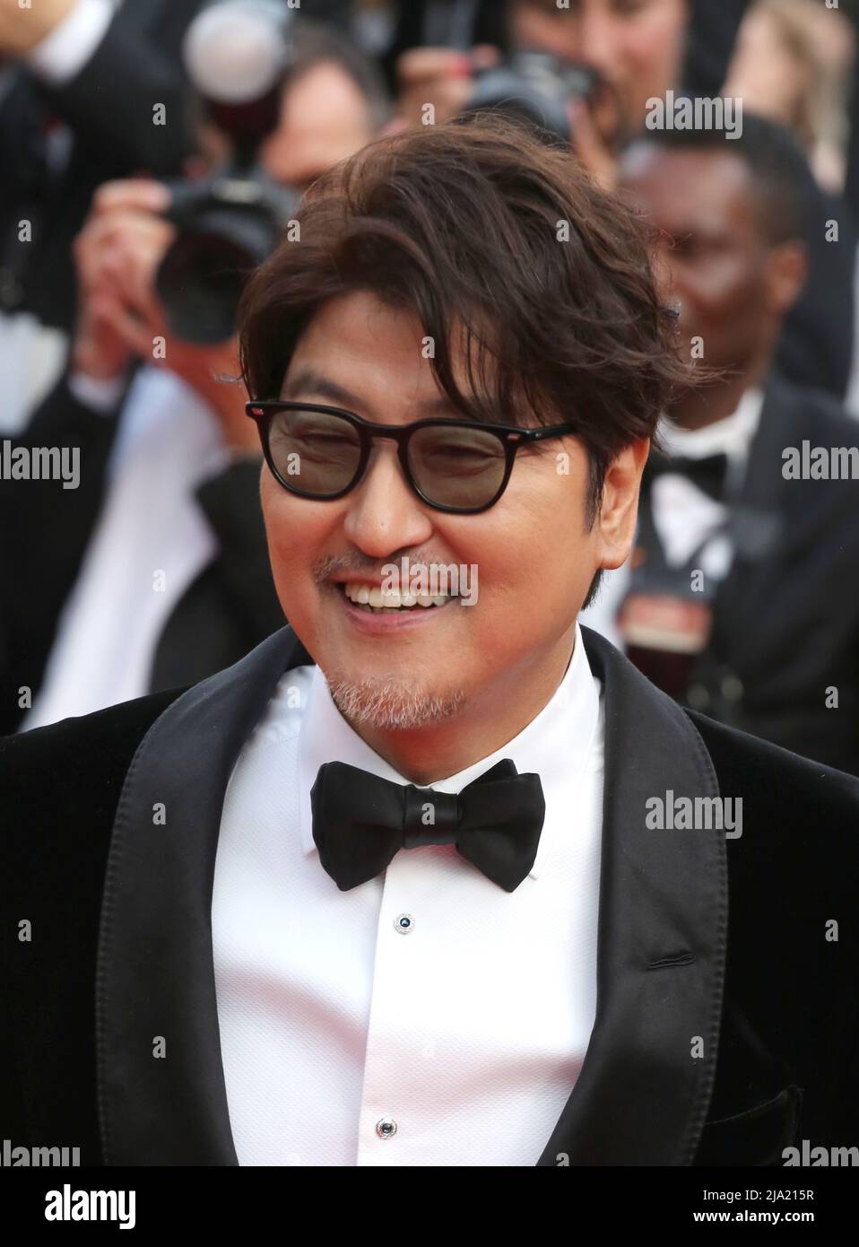 Cannes, France. 26th May, 2022. Song Kang-Ho arriving on the red carpet ...