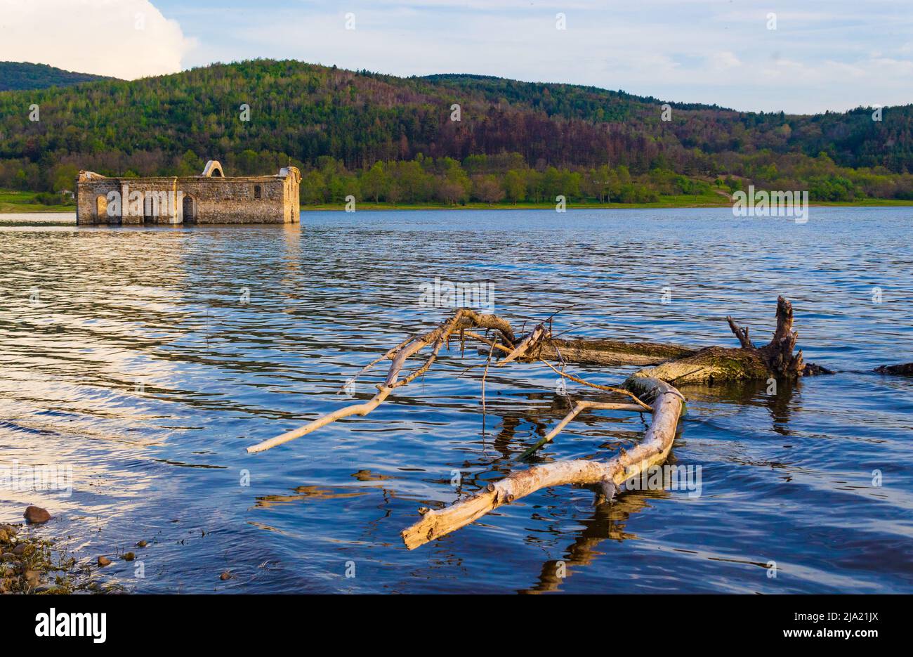 Sunset sky over the sunken church of St.Ivan Rilski at Zhrebchevo Dam ...
