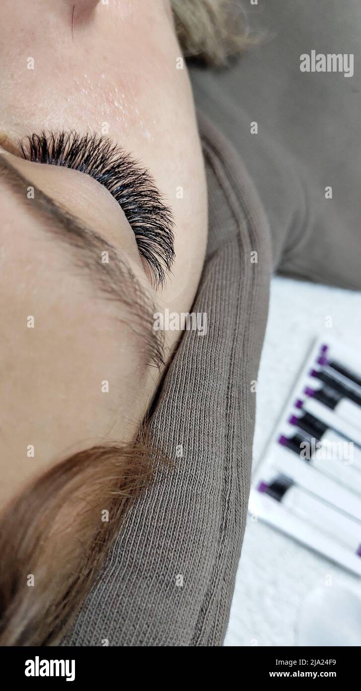 Eyelash extensions in beauty salon macro eye Stock Photo - Alamy