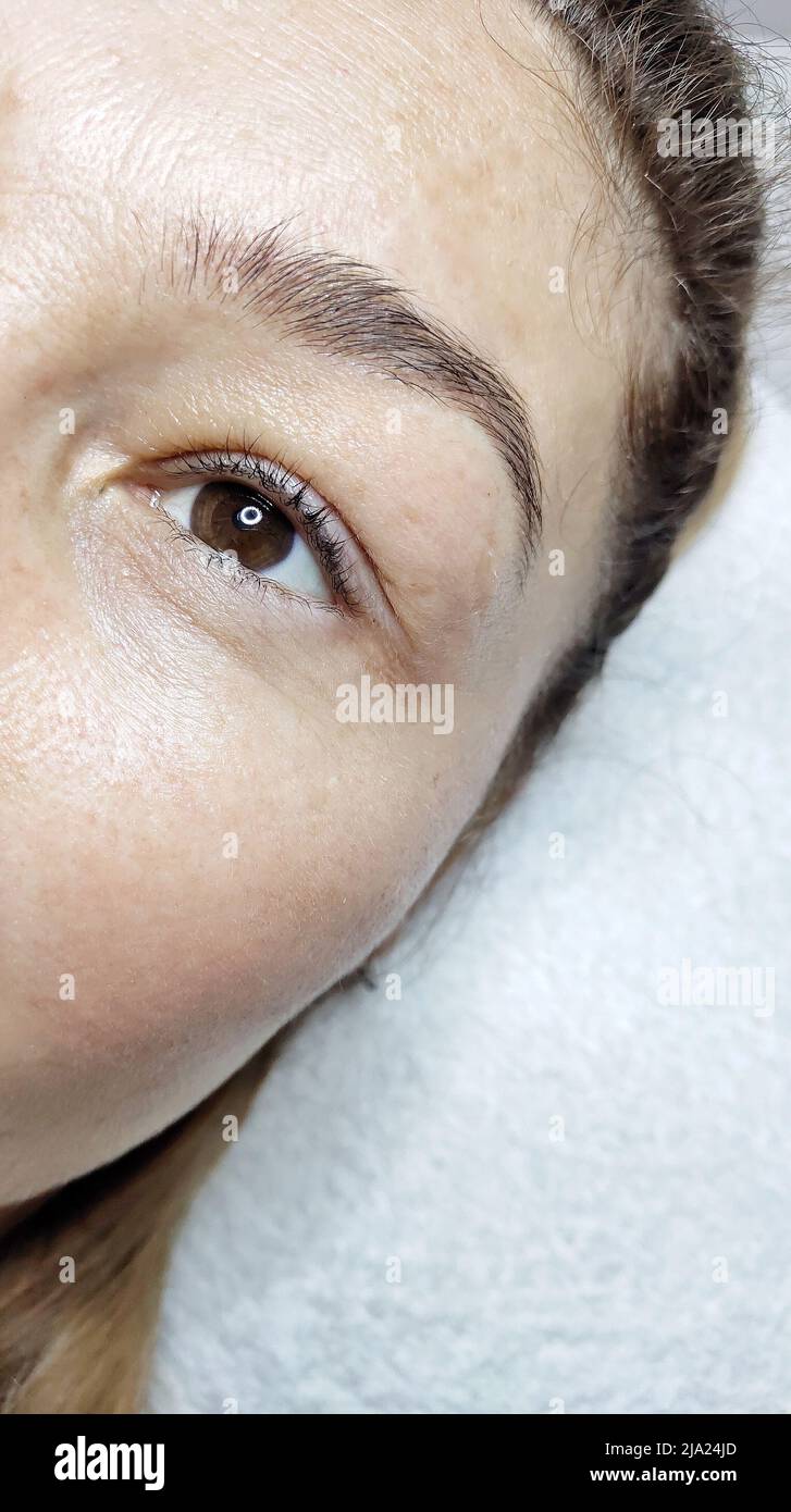 Eyelash extensions in beauty salon macro eye Stock Photo - Alamy