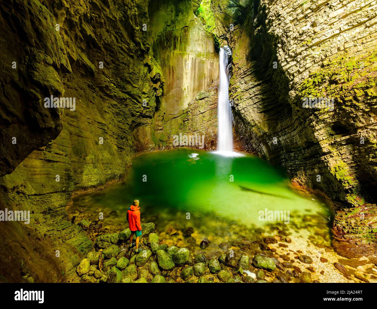 Person in front of Kozjak waterfall, Kobarid, Soca valley, Triglav ...