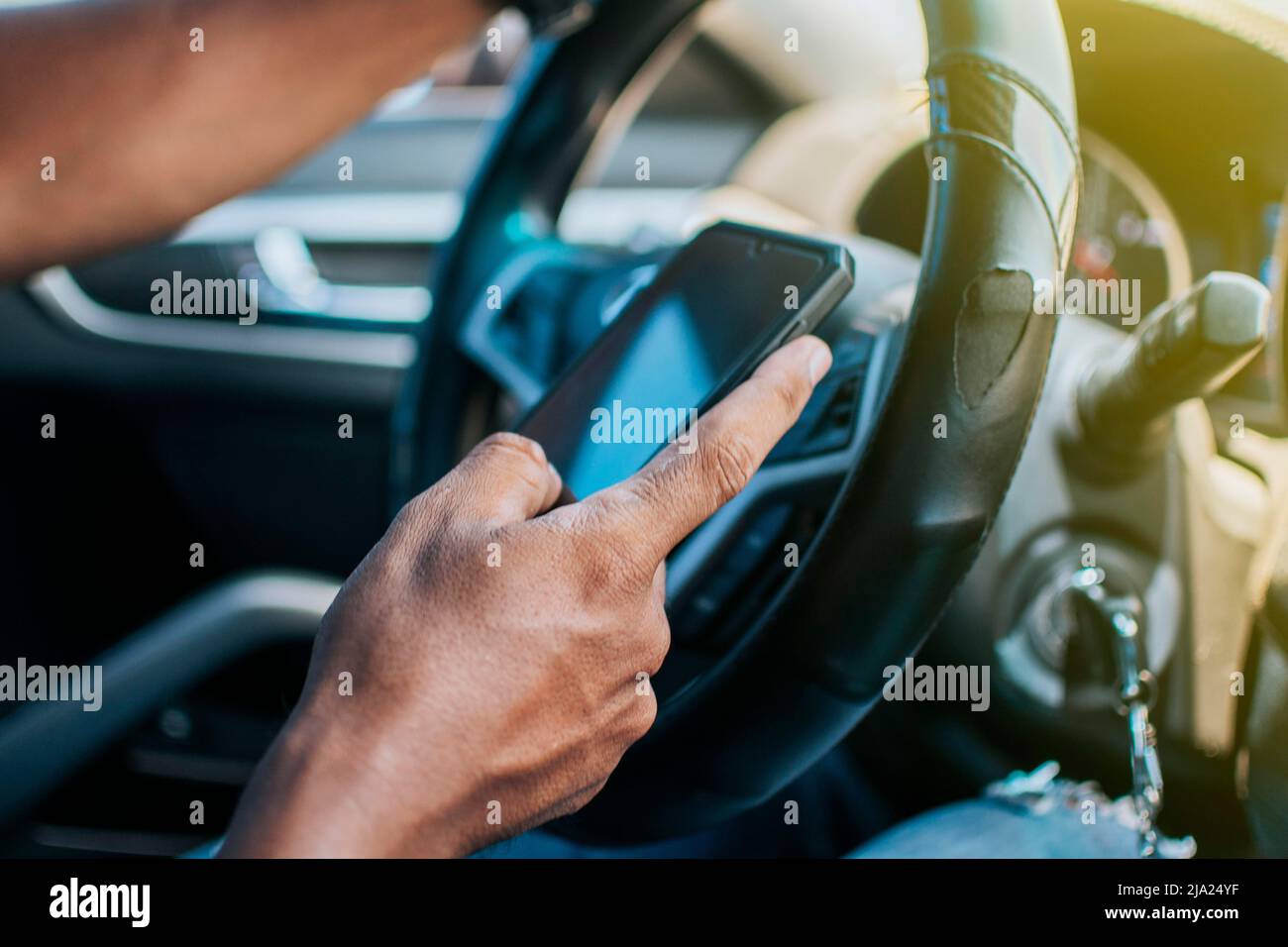 Close up of driver hands using his phone, Person in his car using cell ...
