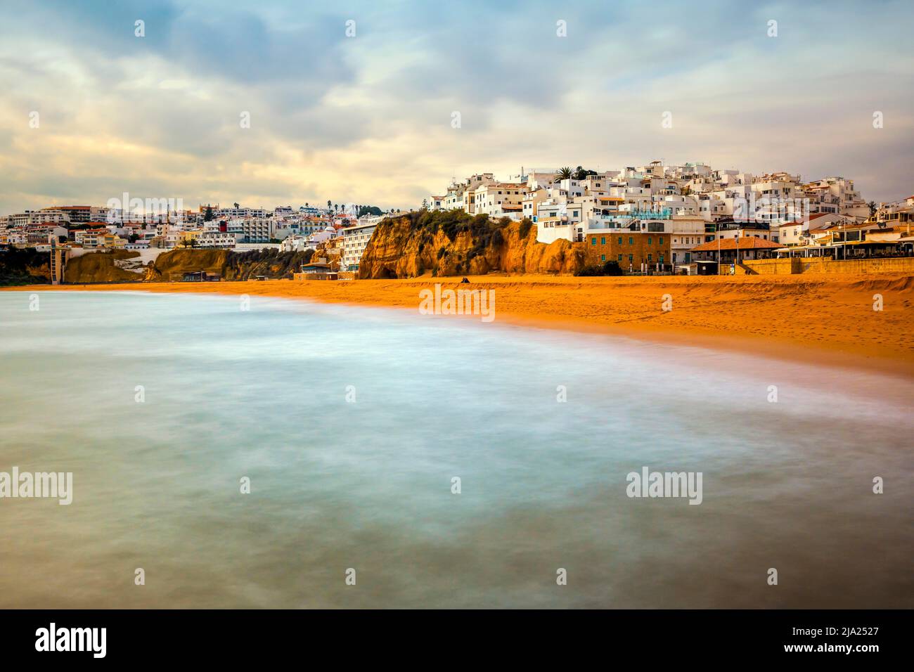 Dramatic view of old town and beach in Albufeira, Algarve, Portugal ...