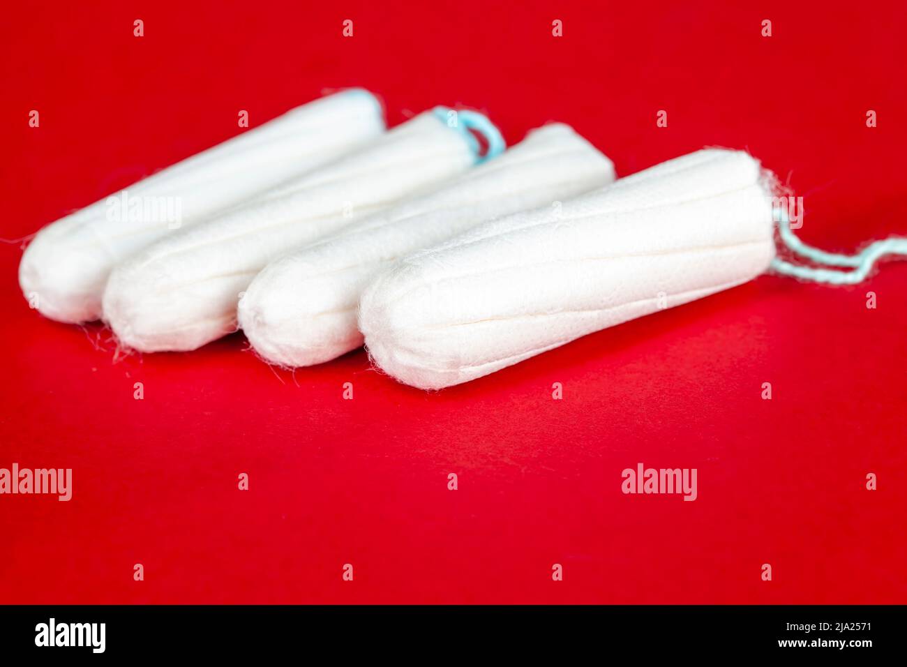 white feminine hygiene products on a red background, feminine hygiene ...