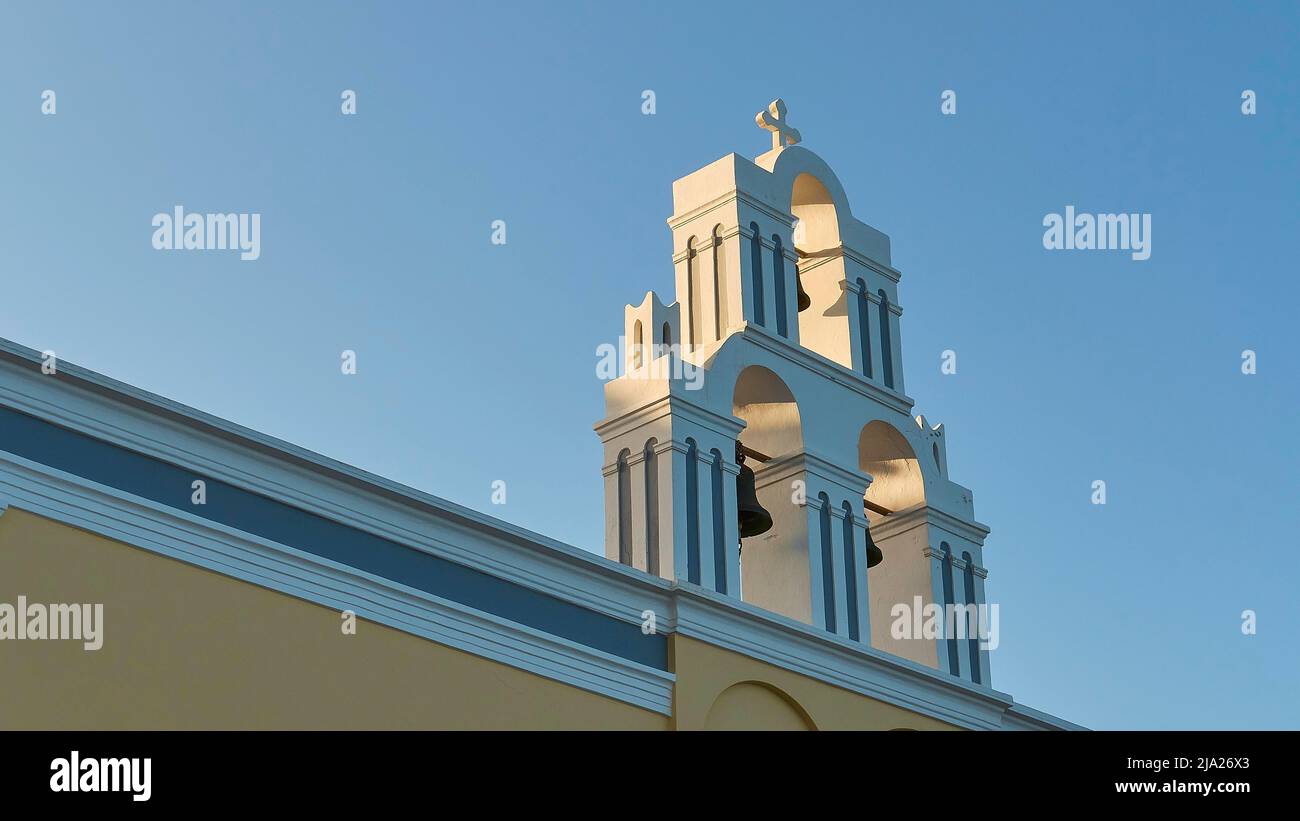 Morning light, bell tower blue-white, cloudless blue sky, main town ...