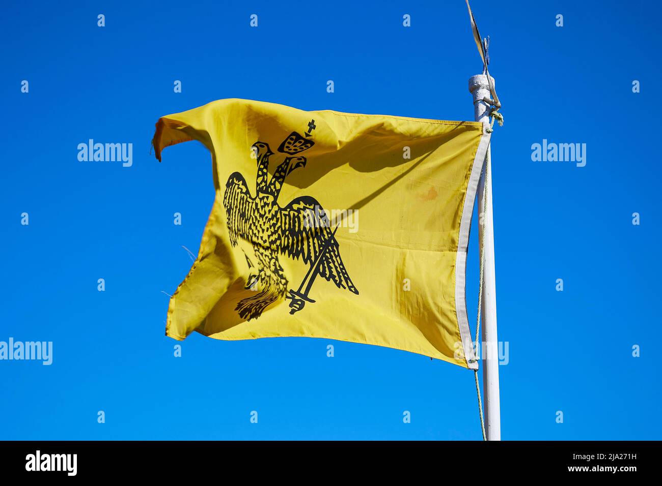 Orthodox flag, yellow, blue sky, Andros Island, Cyclades, Greece Stock ...
