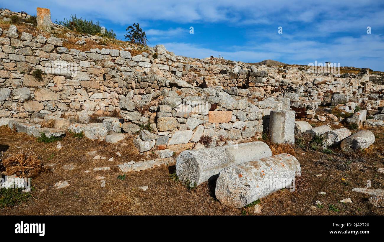 Ancient wall, reclining columns, blue sky, white clouds, Old Thera ...