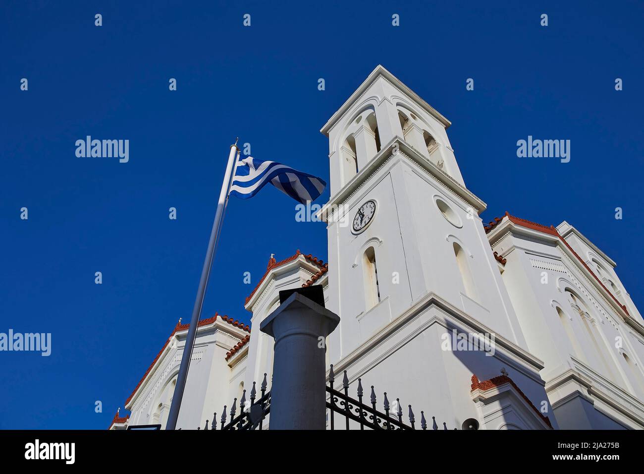 Church, steeple, wide angle shot, Greek national flag, blue cloudless ...