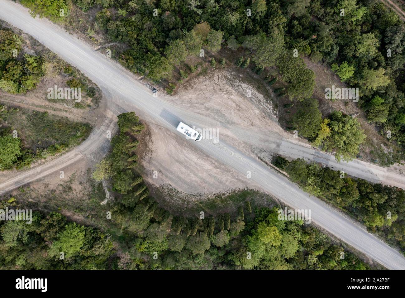Aerial view, camper van on road with cypress trees (Cupressus), aerial ...