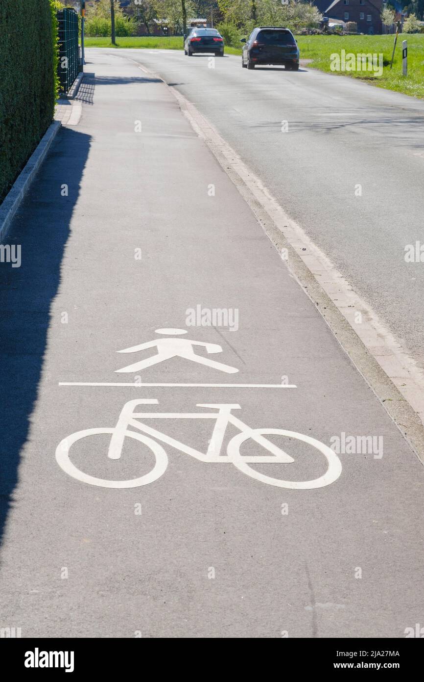 Shared pavement and cycle path, pictogram on asphalt, North Rhine ...