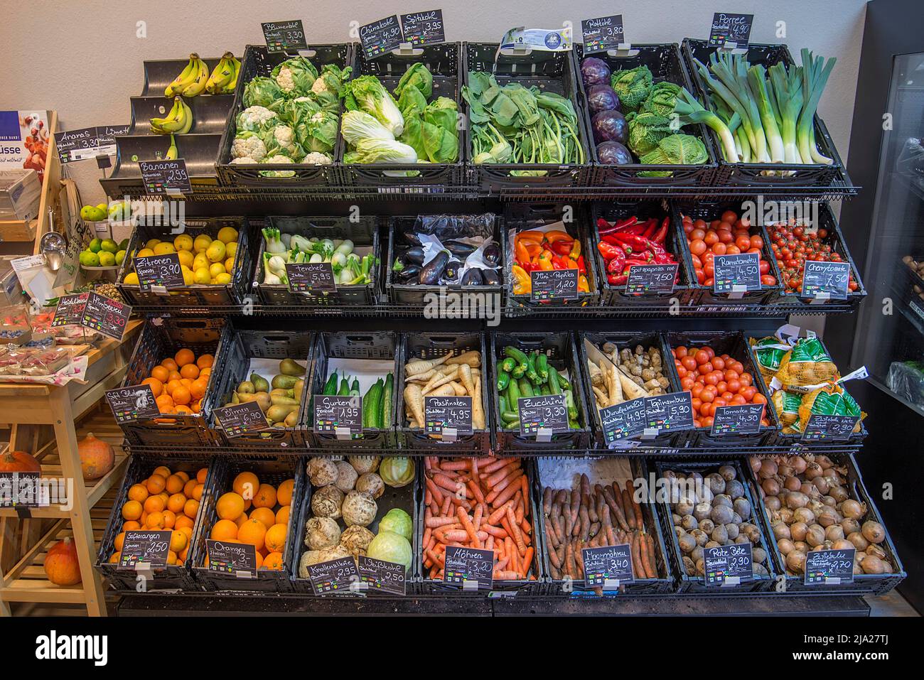 Fresh vegetables in offer boxes in an organic market, Lower Saxony ...