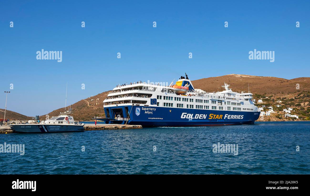 Blue sky, blue and white ferry at anchor, Golden Star Ferries ...