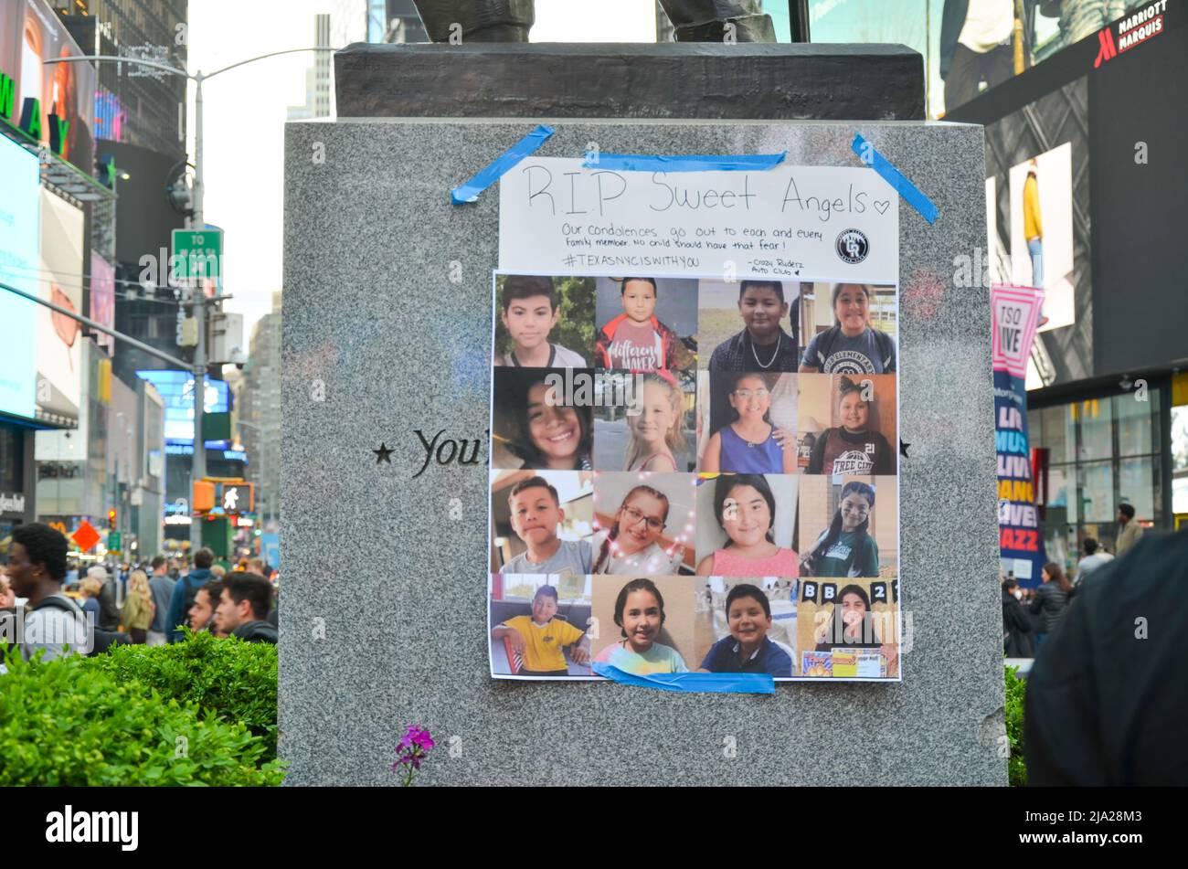 Photos of Deceased Texan school children is seen taped up on Father ...