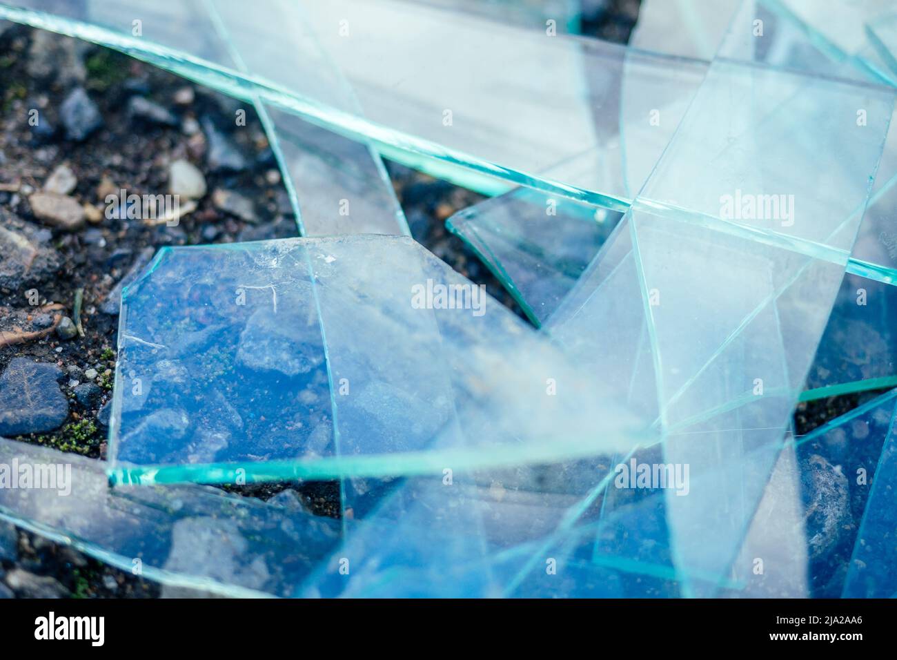 a small pile of broken glass lying on the asphalt Stock Photo - Alamy