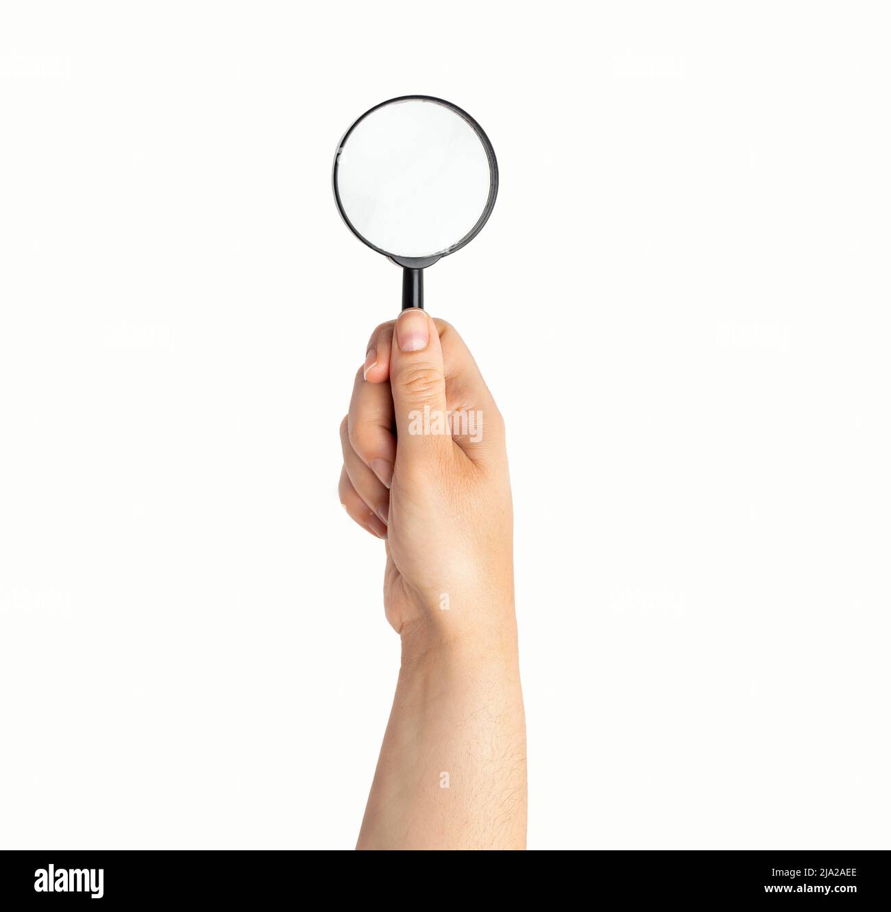 Magnifying glass in hand isolated on white Stock Photo - Alamy