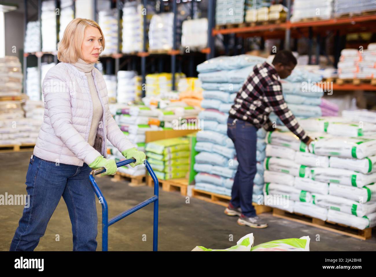 Warehouse pushing trolley hi-res stock photography and images - Alamy