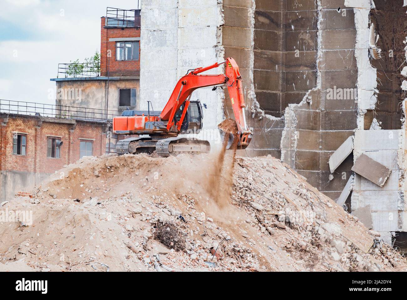 Excavator digs a sand on the construction site territory Stock Photo ...