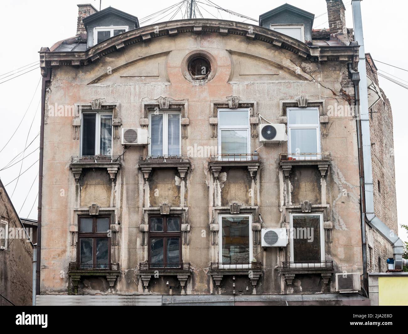 Picture of the facade of an abandoned building seen from afar needing ...