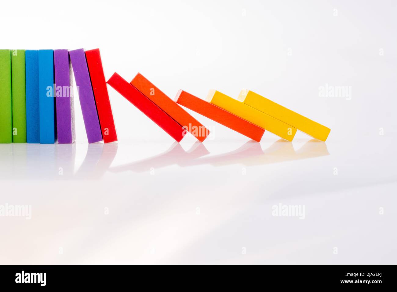Multi color dominoes on a white background Stock Photo - Alamy