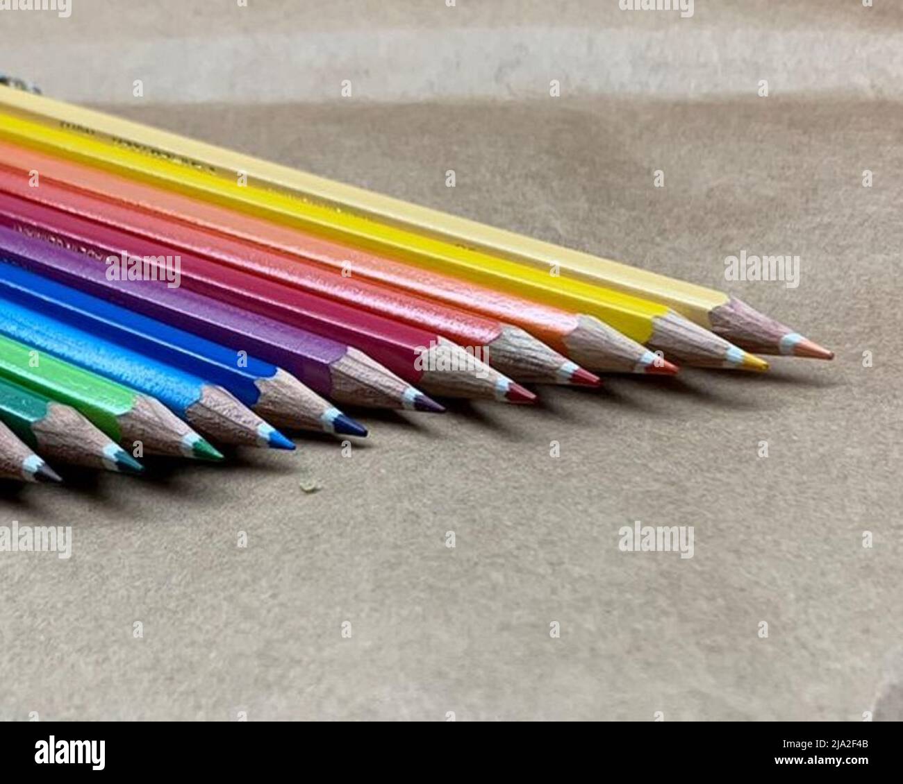 A set of colored wooden pens used for coloring and drawing, stacked ...