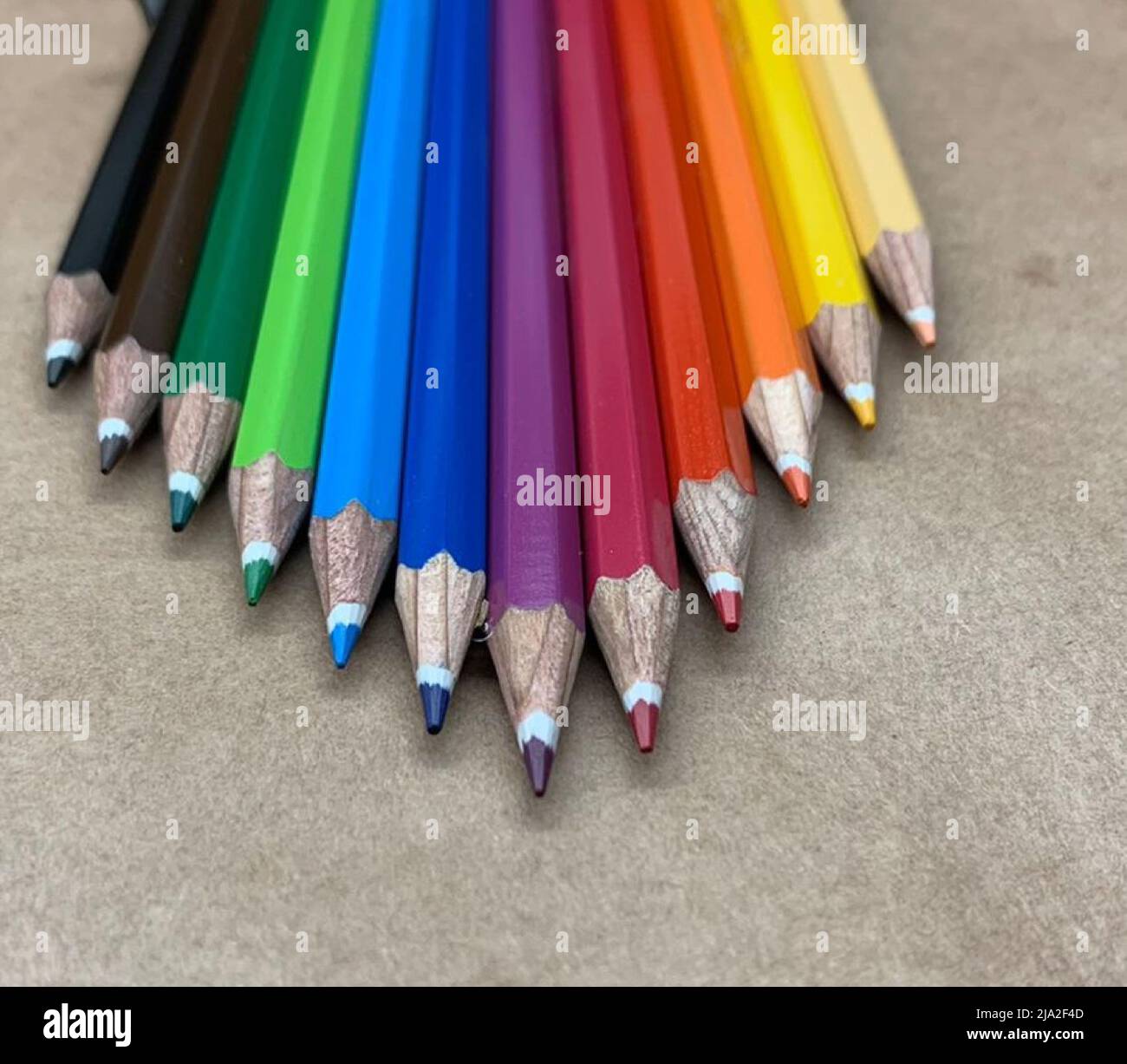 A set of colored wooden pens used for coloring and drawing, stacked ...