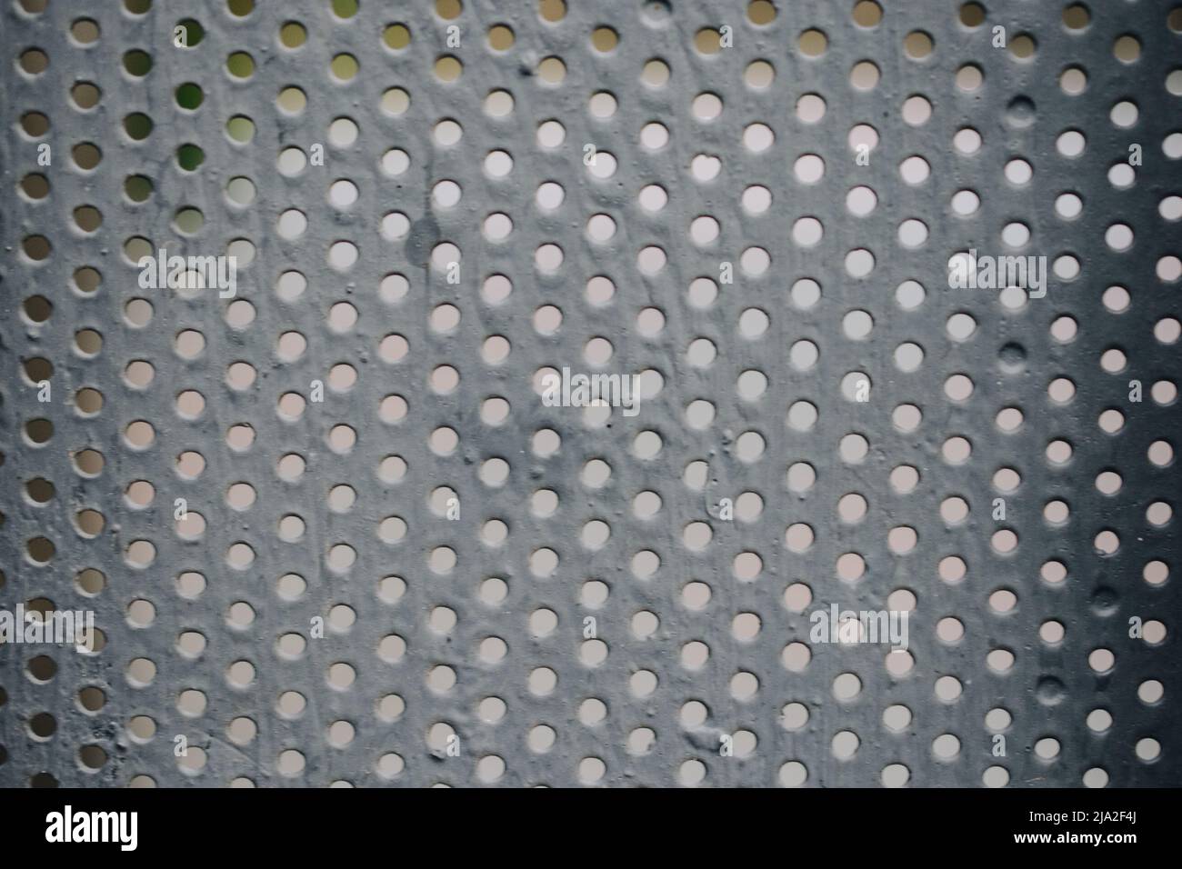 Detailed texture background gray sheet metal perforated. Steel plate ...